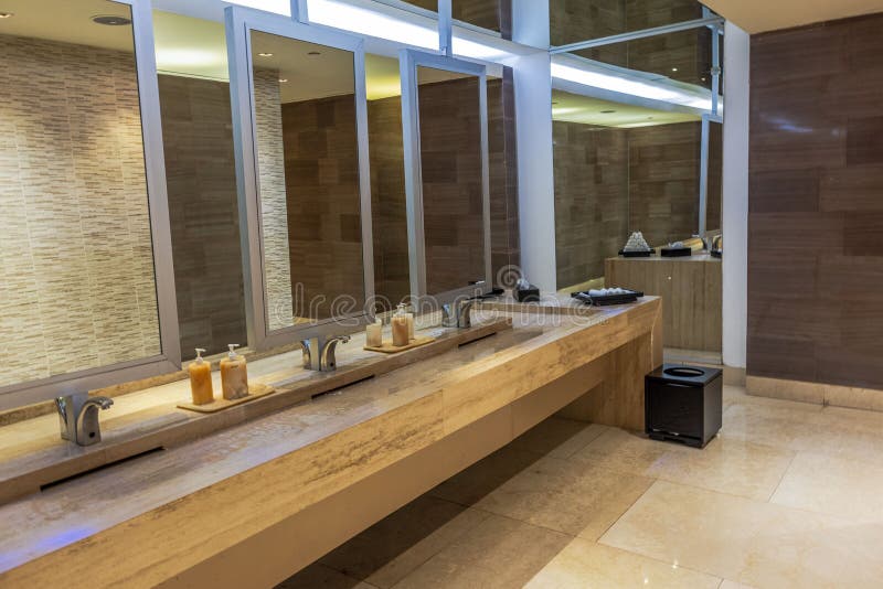 Modern Restroom Interior Featuring Sleek Marble Countertop with ...