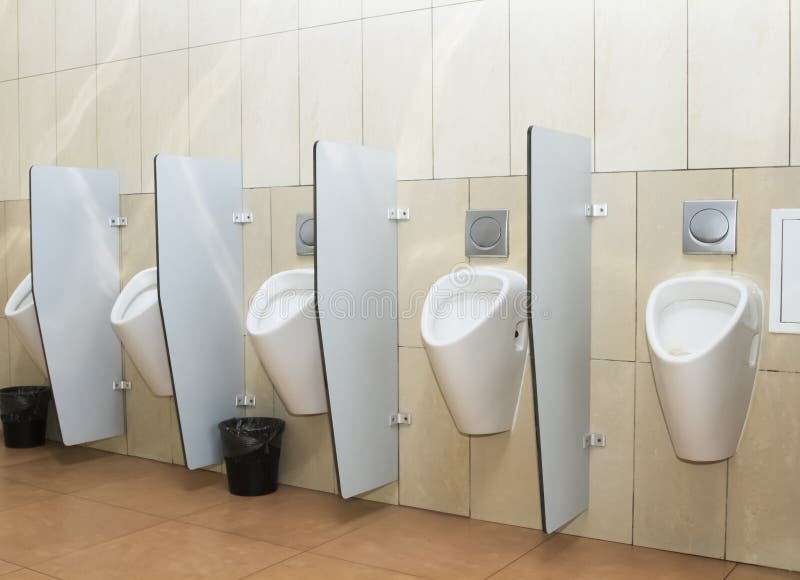 Restroom Interior with Urinal Row Stock Photo - Image of chrome ...