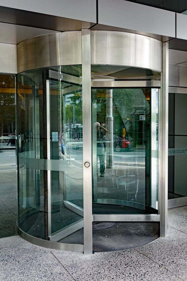 Modern Revolving Glass Door Stock Photo - Image of seal, stainless ...