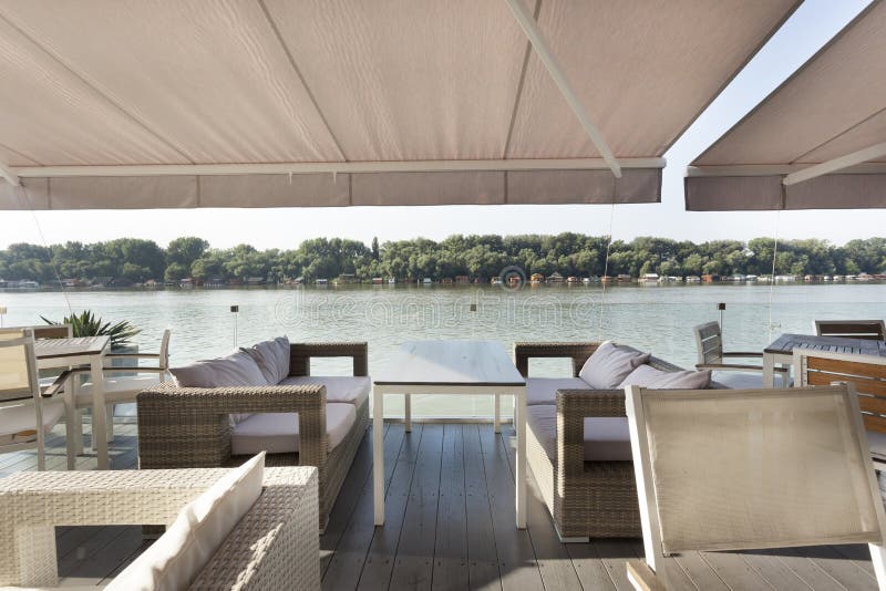 Riverside Terrace and Fireflies Stock Image - Image of stream, park ...