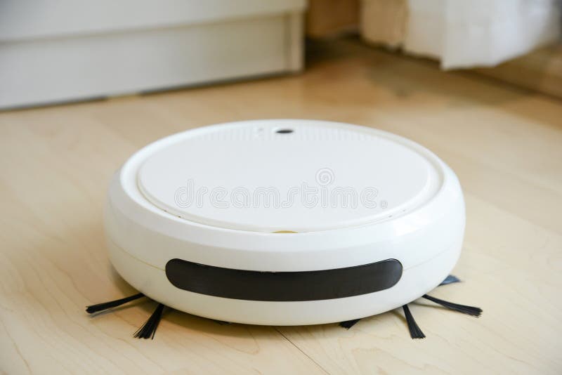 Modern Robot Vacuum Cleaner Near Sofa with Resting Woman in Room. Stock Photo - Image of ...