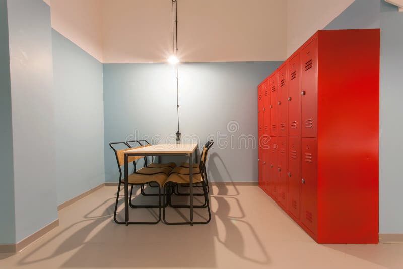 Modern Room Looks Like Prison with Table and Iron Locker in a Hostel ...