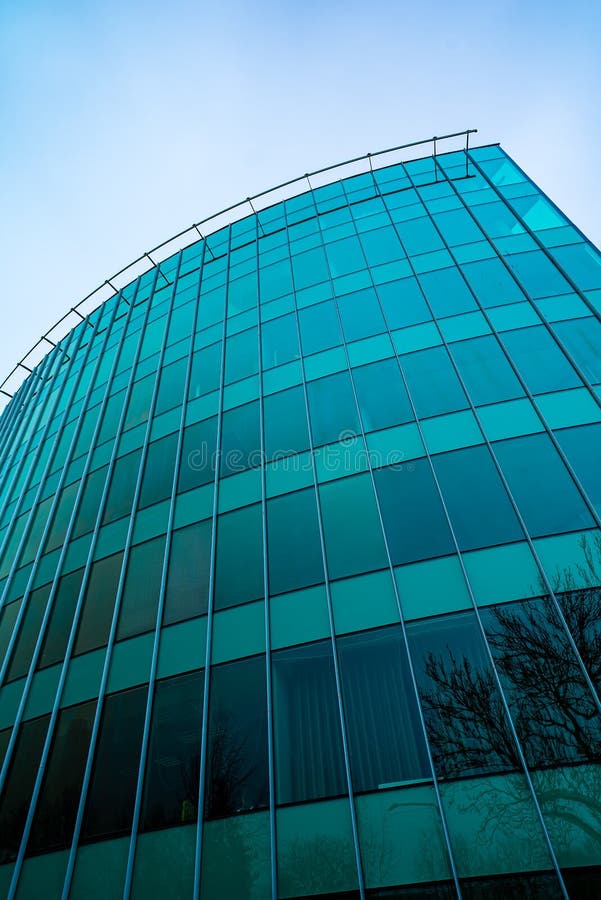 Round Glass Conference Table with White Chairs. There is an Antiseptic ...