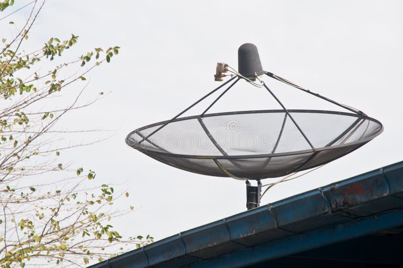Modern Satellite Dish on the Roof Top with Tree Leaves Branch Stock ...
