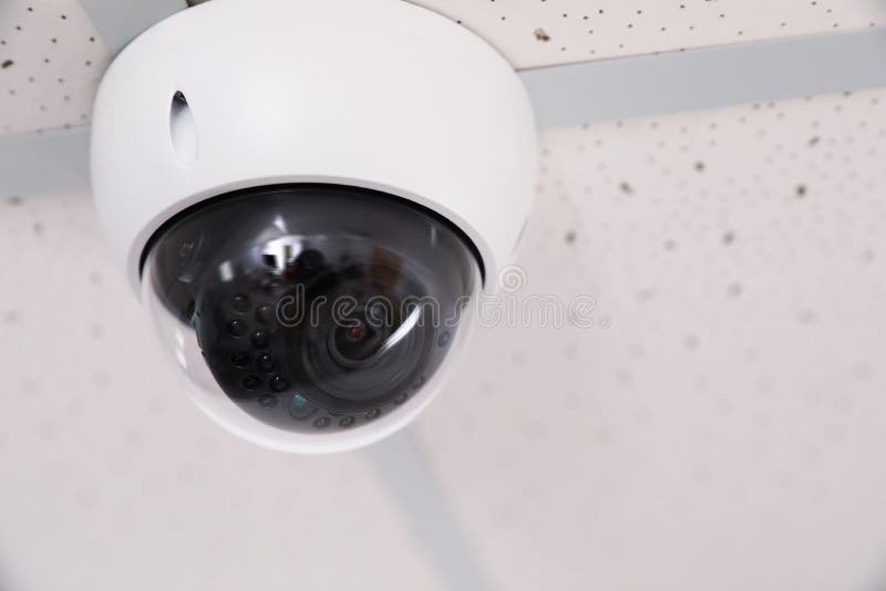 Modern Security CCTV Camera on Ceiling in Office. Protection System ...