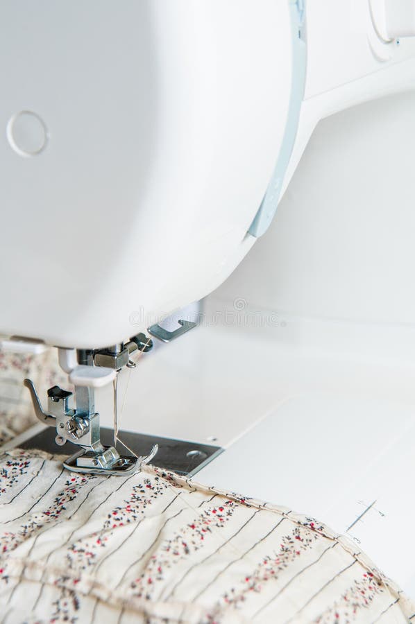 Modern Sewing Machine with Light Flower Pattern Fabric. Stock Image ...