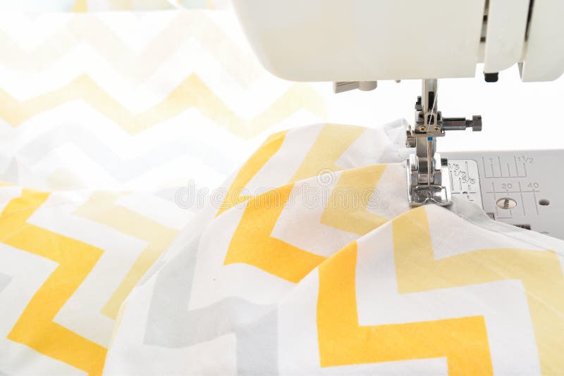 Modern Sewing Machine and Yellow Fabric in Zigzag. Sewing and Home ...