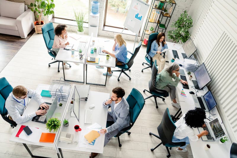 Modern Shared Workspace with Diverse Professionals Collaborating on ...