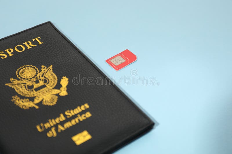 Modern SIM Card and Passport on Light Blue Background, Closeup Stock ...