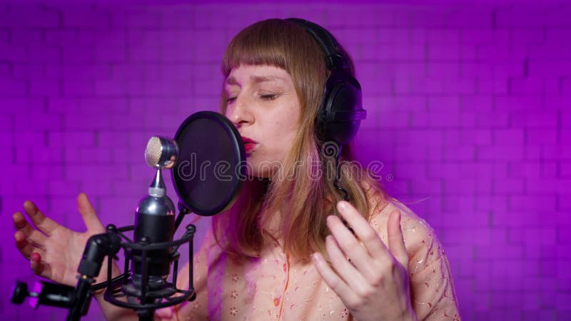 Singer Girl Records Song in Microphone with Pop Filter in Recording ...