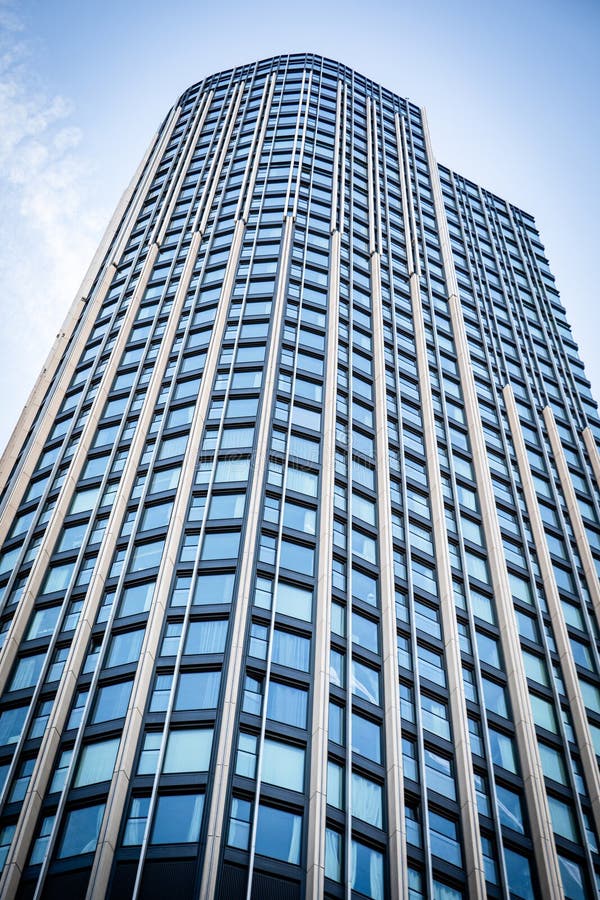 Modern Skyscraper Architecture with Glass Windows Reflecting Urban Sky ...