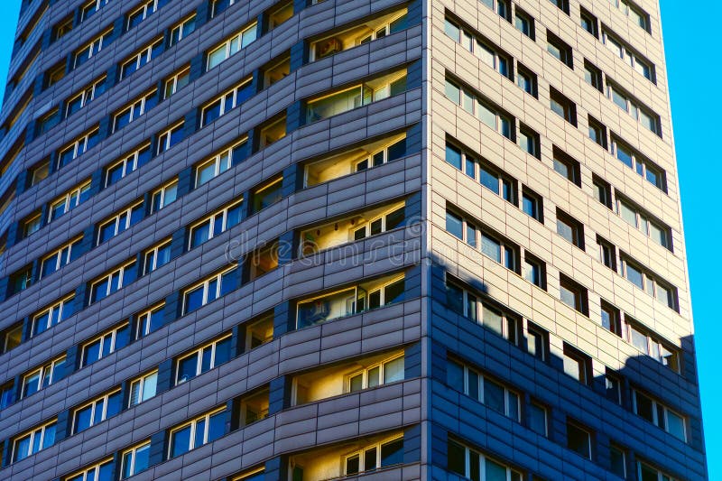 Modern Skyscraper Building with a Grid of Windows Reflecting Sunlight ...