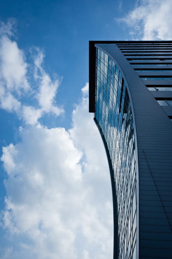 Modern Skyscraper Reaching the Blue Sky with Clouds Stock Image - Image ...