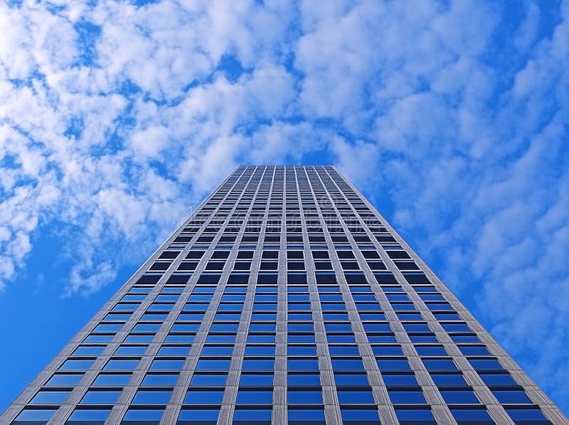 Modern Skyscraper Reaching Towards Blue Sky with White Clouds Minimal ...