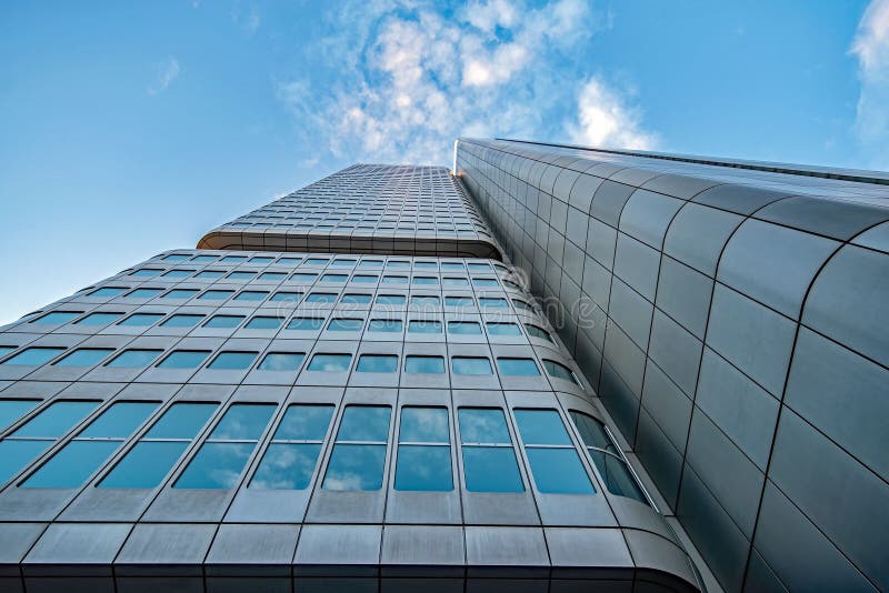 A Tall Building Has Glass Windows and Windows that Look Up Stock Image ...