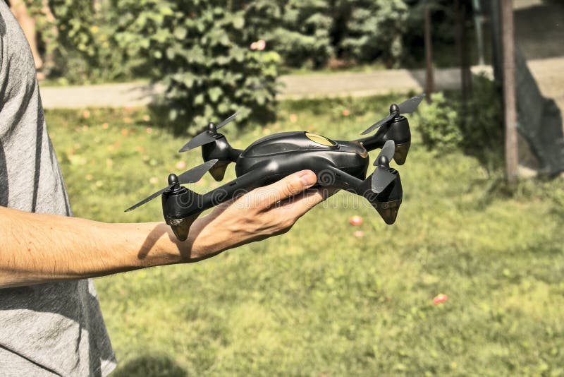 Modern Small Compact Quadcopter in a Man`s Hand. Stock Photo - Image of ...