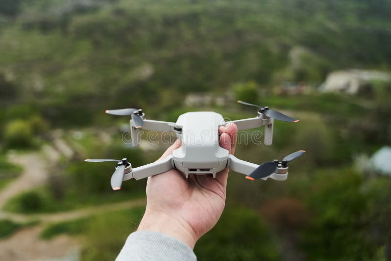 Modern Small Compact Quadcopter in a Man S Hand. Launching a Drone from ...