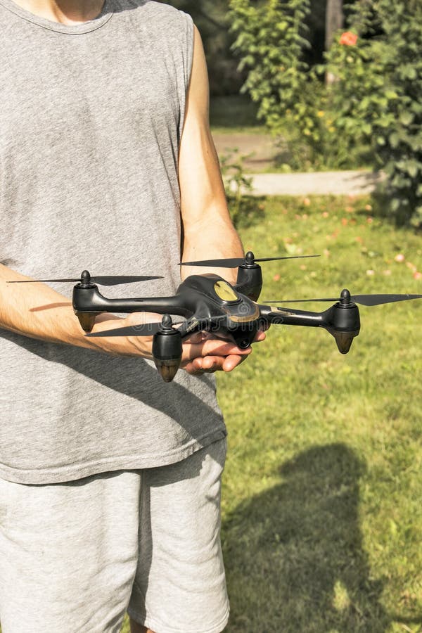 Modern Small Compact Quadcopter in a Man`s Hand. Stock Image - Image of ...