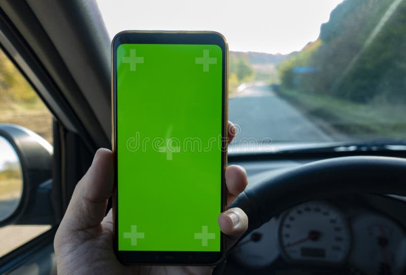 Modern Smart Phone with Isolated Green Screen for Mockup. the Driver ...