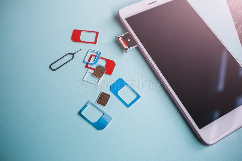 Modern Smartphone Lying on the Table. Different Micro and Nano Sim ...