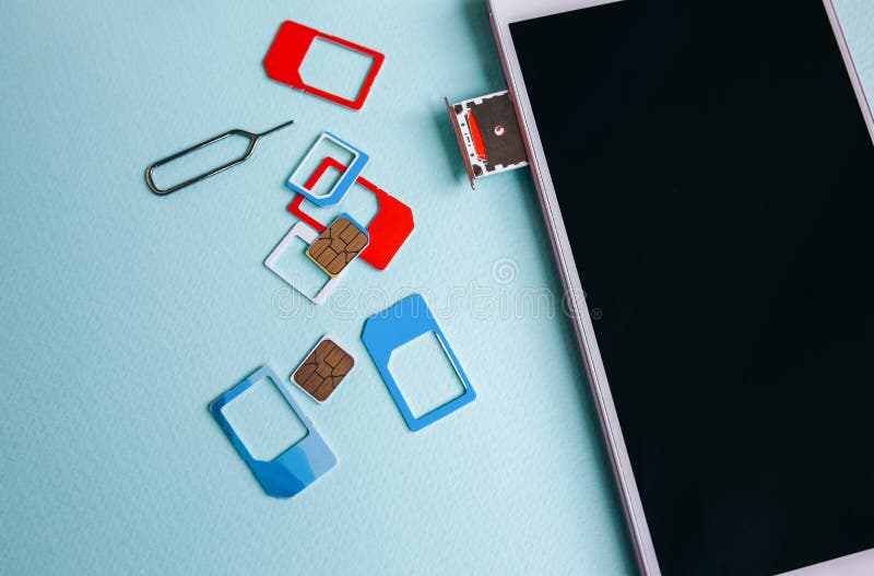 Modern Smartphone Lying on the Table. Different Micro and Nano Sim ...
