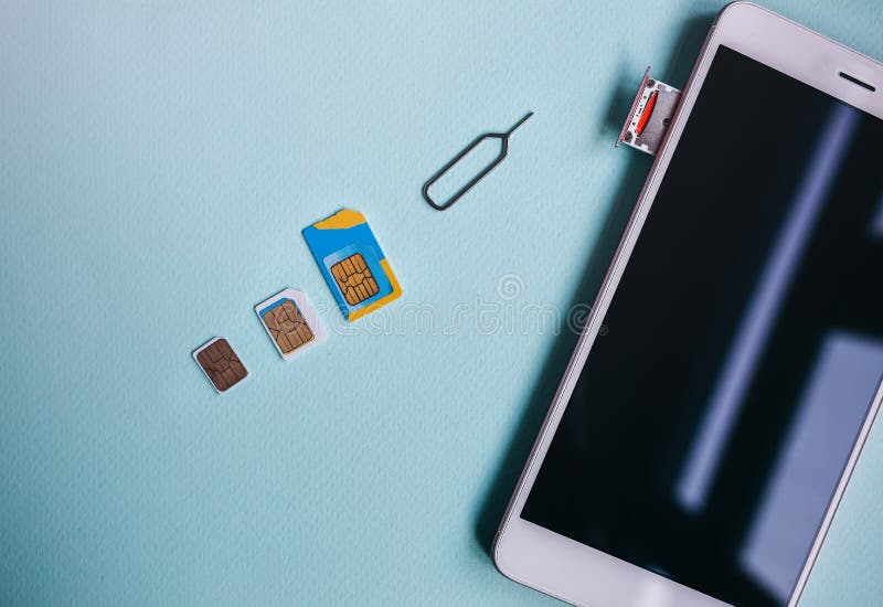 Modern Smartphone Lying on the Table. Different Micro and Nano Sim ...