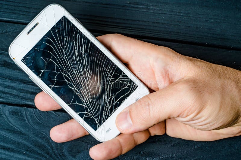 Modern Smashed Electronic Smartphone. Broken Cellphone Holding in Hands ...
