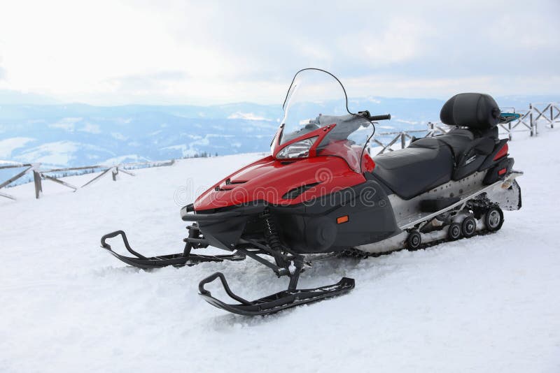 Snowmobile on Mountain Peak Stock Photo - Image of cold, snowmobiles ...