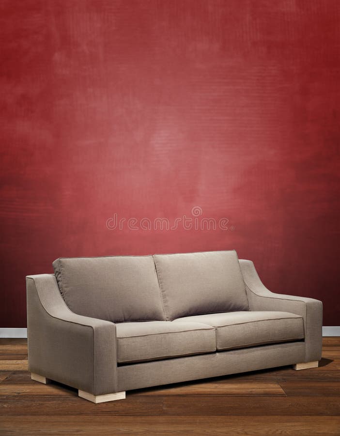 Modern Sofa Against Textured Red Wall Stock Photo - Image of instant ...
