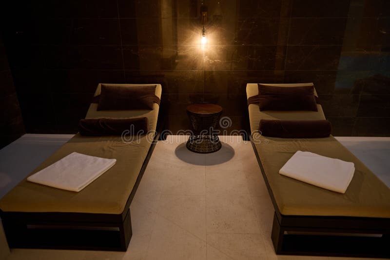 Modern Spa Center Interior. Close-up of Loungers in Spa Room at ...