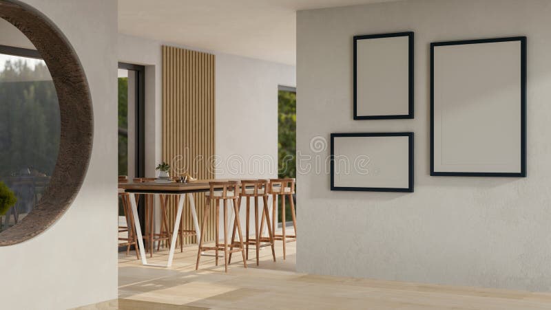 A Modern Spacious Indoor Corridor with a Table with Stools, and Frames ...