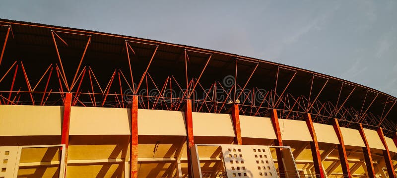 Modern Stadium Structure with Bright Orange Beams and Angular Design ...