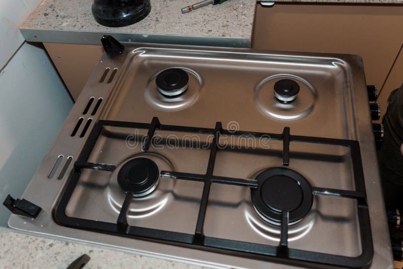 Modern Stainless Steel Gas Cooktop with Three Burners and Black Knobs ...