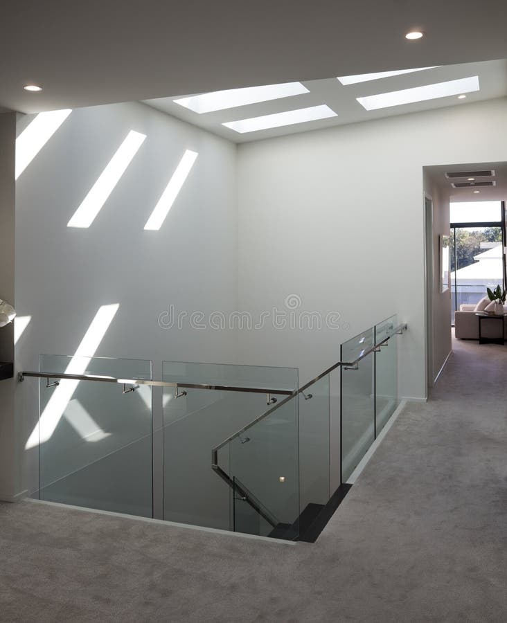 Modern Staircase with Bright Sunlight through Ceiling Windows Stock ...