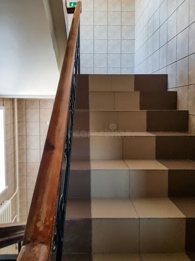 Modern Staircase with Ceramic Tile Steps and Wooden Handrails, Vertical ...