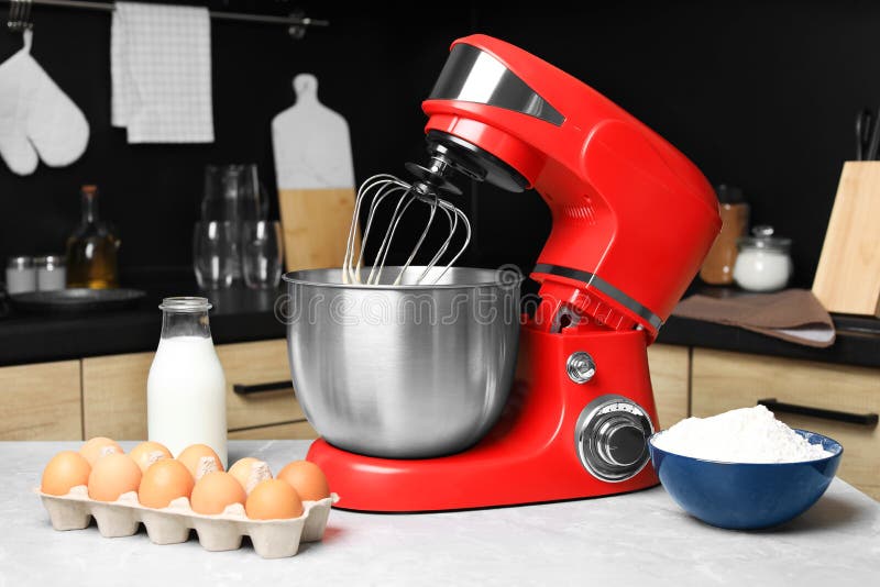 Modern Stand Mixer and Ingredients on Table in Kitchen. Home Appliance ...