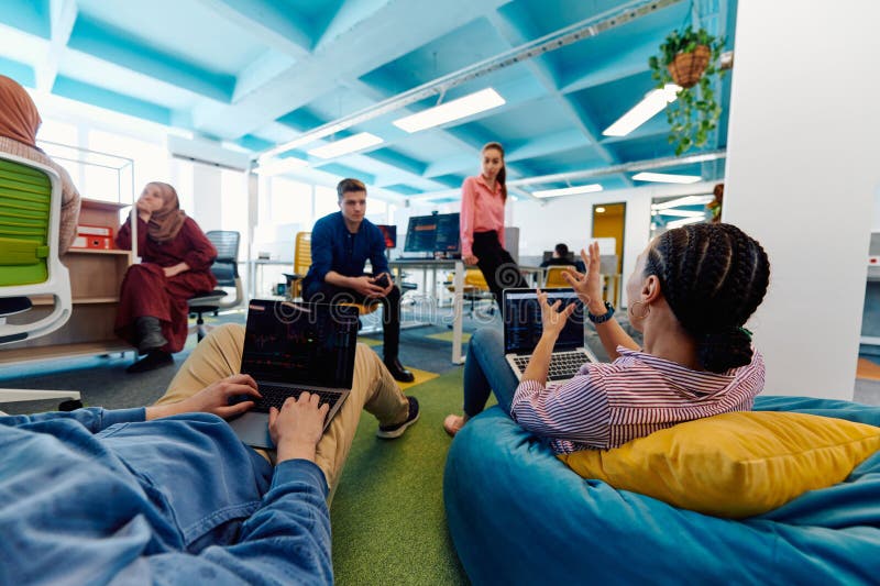 In a Modern Startup Office, a Diverse Group of Young and Capable ...