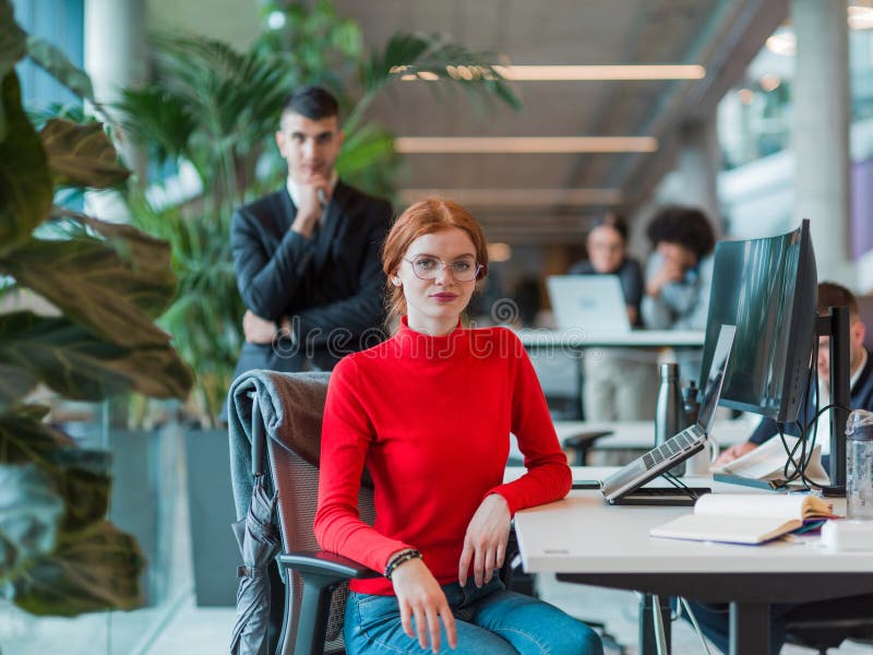 In a Modern Startup Office, a Diverse Group of Young Professionals ...