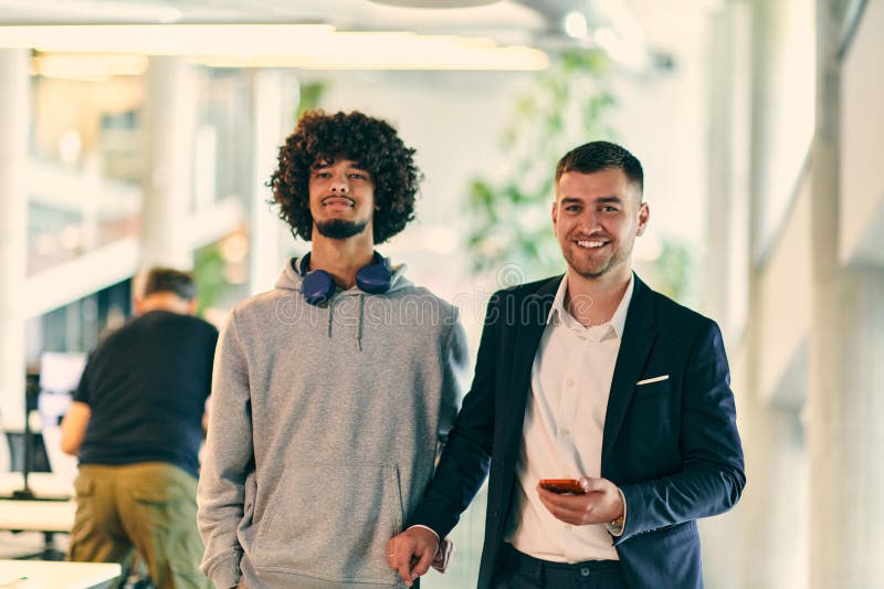 In a Modern Startup Office Setting, a Business Director and a Young ... In a Modern Startup Office Setting, a Business Director and a Young ...