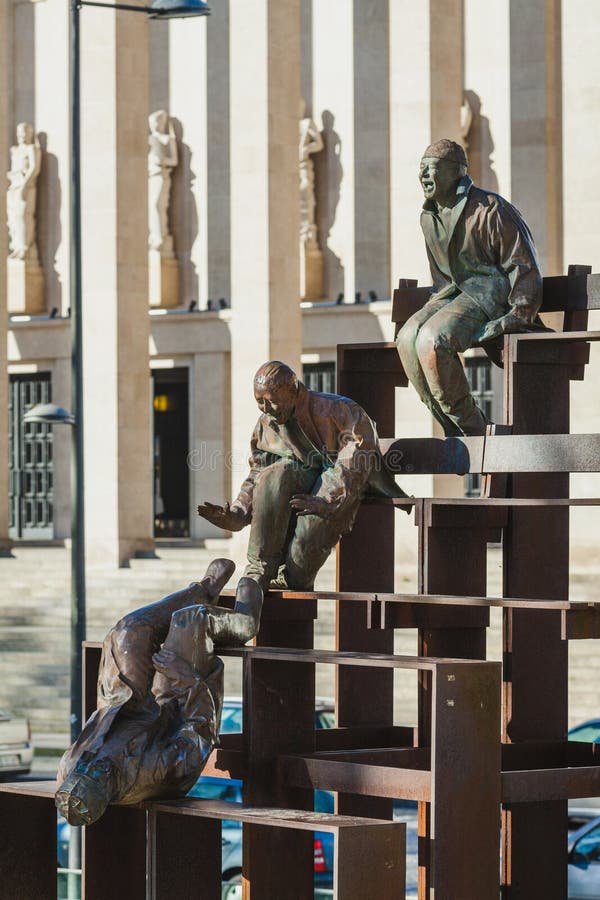 Modern Statue with Sitting Men Editorial Photography - Image of ...