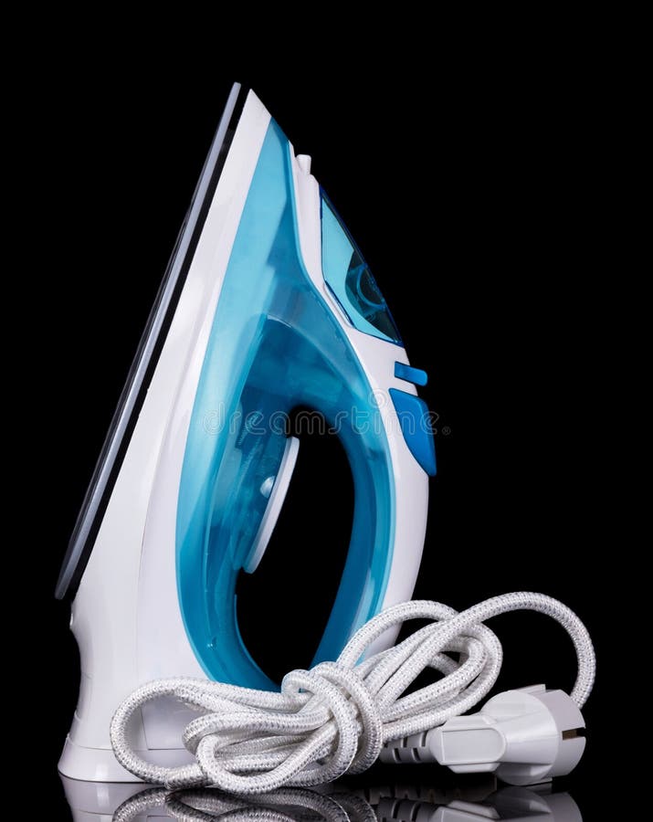 Modern Steam Iron Close-up Isolated on Black Background. Stock Photo ...