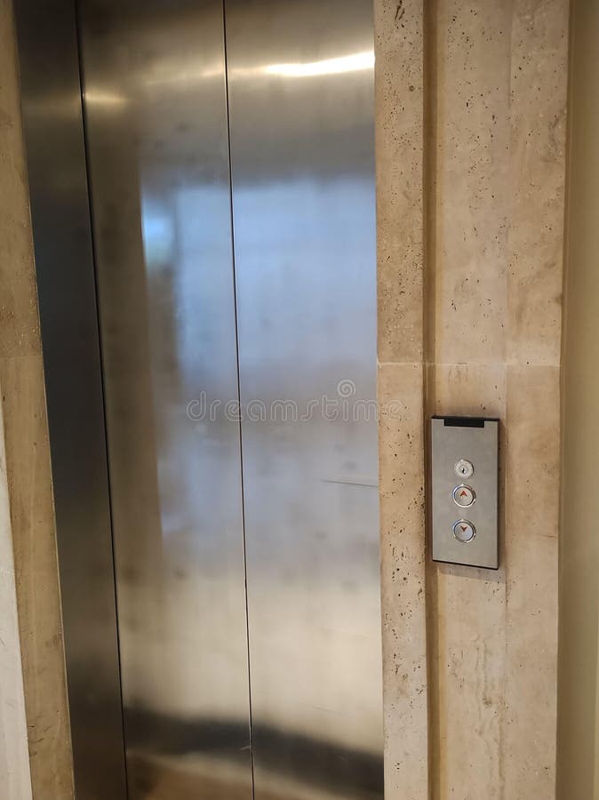 Modern Steel Elevator on Stone Wall Stock Image - Image of stainless ...