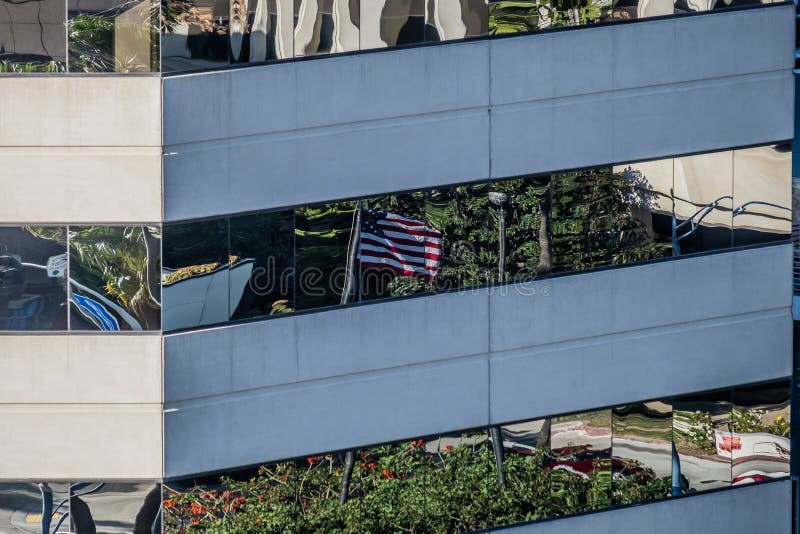 Stone and Glass Office with American Flag Reflected Stock Image - Image ...