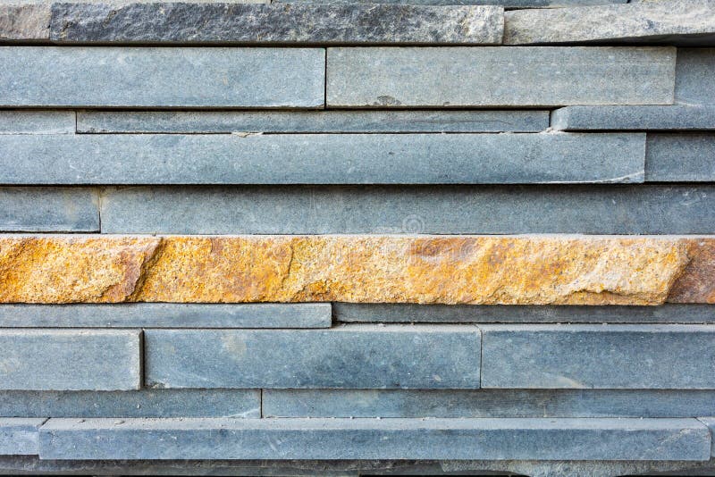 A Modern Stone Wall Made of Long Large Cuts of Stones. Stock Photo ...