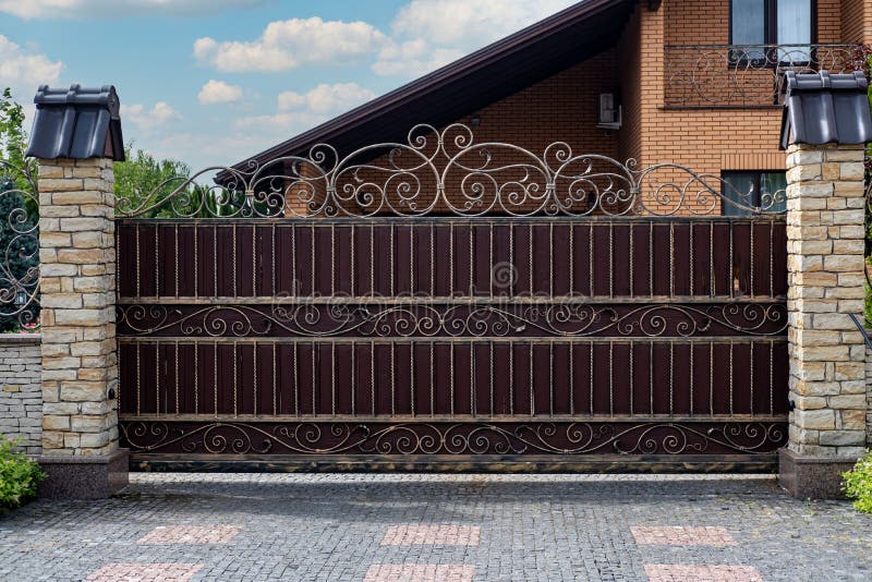 Modern Strong Decorative Gates with Wrought Iron Elements Near a ...