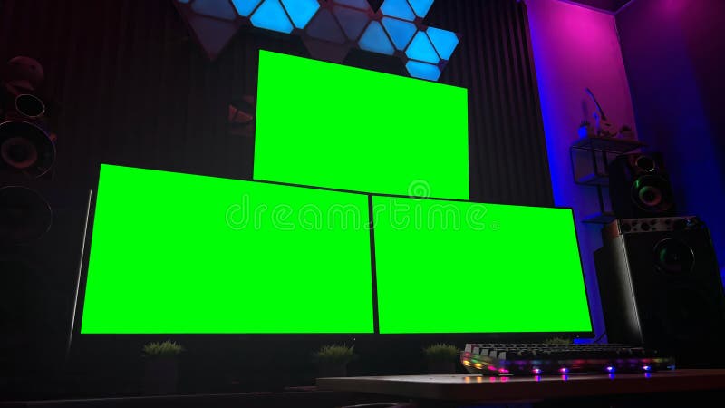 Modern Studio Setup with Green Screen Monitors and Gaming Peripherals ...