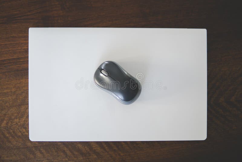 Modern Style White Laptop with Mouse on a Dark Wooden Table Stock Image ...