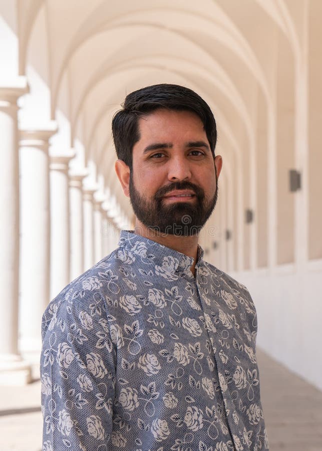 Modern, Stylish Pakistani Man with Dark Beard and Light Clothes Stands ...