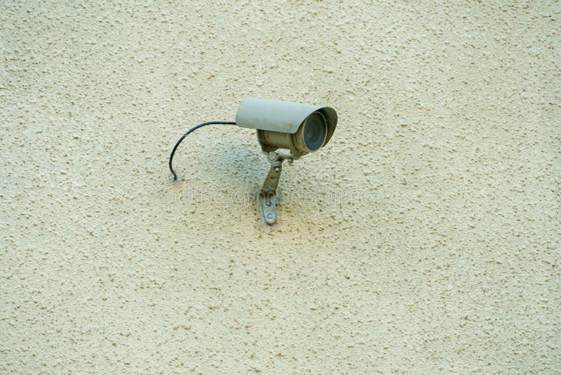 A Modern Surveillance Camera Mounted on the Wall of a Guarded Building ...