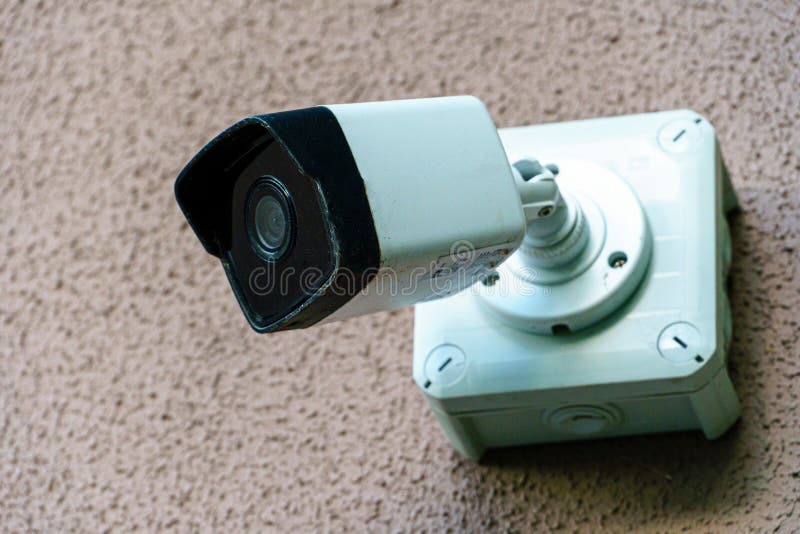 A Modern Surveillance Camera Mounted on the Wall of a Guarded Building ...